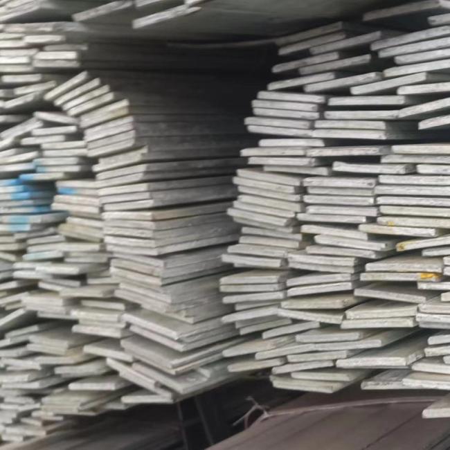 Galvanized flat steel sheets showing black surface finish and uniform coating