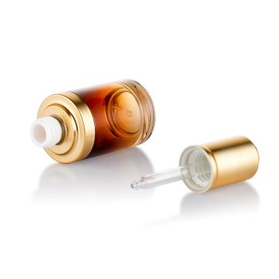 Cina bottiglia cosmetica del contagoccia di 35g Amber Oval PETG con il logo di timbratura caldo per il siero in vendita