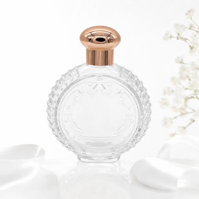 China Premium Zamak Perfume Bottle Cap with Rose Gold Embossed Top, Airtight Seal, and CNC Carved Design for sale