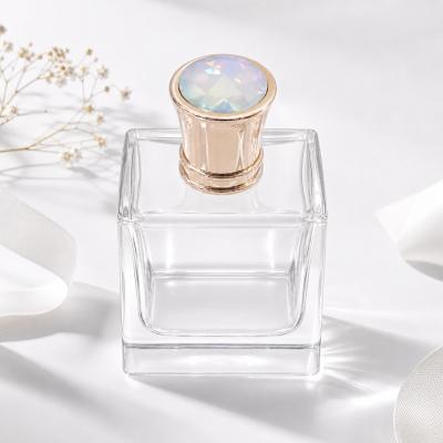 China Customized Design Eco-Friendly Lightweight Zamak Perfume Bottle Cap with Stone Accent for sale