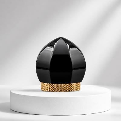 China Glossy Black Lotus Zamac Perfume Cap With Gold Mesh Base Luxury Metal Fragrance Bottle Lid Custom Logo for sale