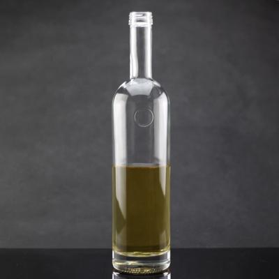 Cina Bottiglie di imballaggio di olio d'oliva a colletto di vetro con disegno poligonale e chiusura del tappo di sughero in vendita