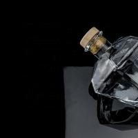 China Customized Logo Engraving Transparent Unique Design Shape Gin Glass Bottle With Cork for sale