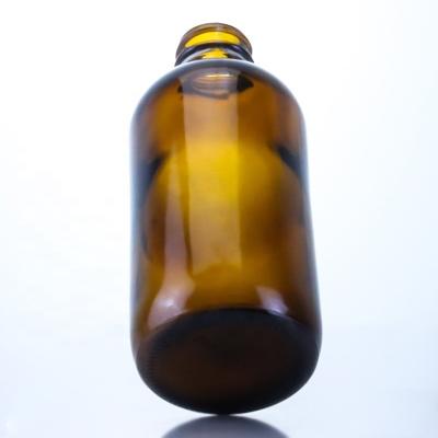 Cina Bottiglia di birra di vetro vuota da 350 ml con tappo di seta a corona e stampaggio a caldo in vendita