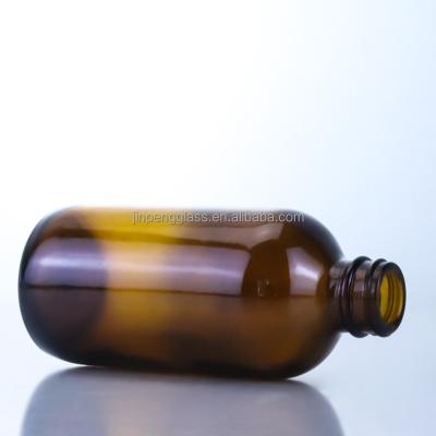 Cina Bottiglia di birra di vetro vuota da 350 ml con tappo di seta a corona e stampaggio a caldo in vendita