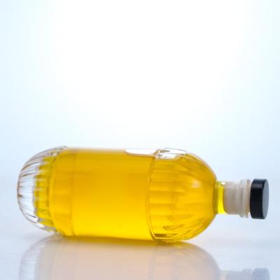 Cina Bottiglia di vetro per bevande industriali con disegno in rilievo e forma rotonda di sughero in vendita