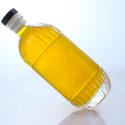 Cina Bottiglia di vetro per bevande industriali con disegno in rilievo e forma rotonda di sughero in vendita
