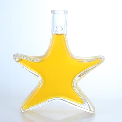Cina Whiskey Gin Rum Vodka Bottiglia di liquore in vetro a forma di stella con capo di sughero e base di vetro in vendita