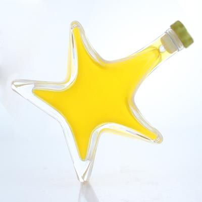 Cina Whiskey Gin Rum Vodka Bottiglia di liquore in vetro a forma di stella con capo di sughero e base di vetro in vendita