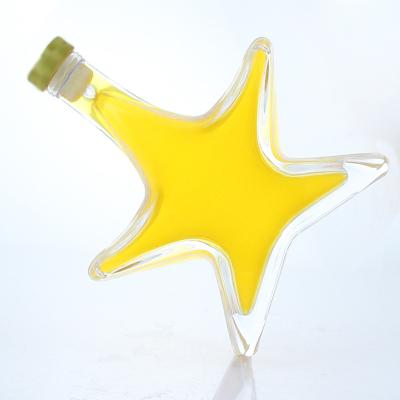 Cina Whiskey Gin Rum Vodka Bottiglia di liquore in vetro a forma di stella con capo di sughero e base di vetro in vendita