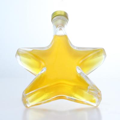 Cina Whiskey Gin Rum Vodka Bottiglia di liquore in vetro a forma di stella con capo di sughero e base di vetro in vendita