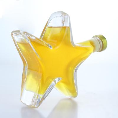 Cina Whiskey Gin Rum Vodka Bottiglia di liquore in vetro a forma di stella con capo di sughero e base di vetro in vendita