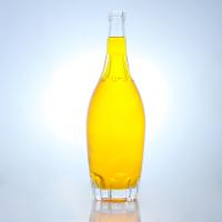 China Customization Round Shape Liquor Bottle with Embossed Design and Customized Cork Cap for sale