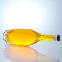 China Customization Round Shape Liquor Bottle with Embossed Design and Customized Cork Cap for sale