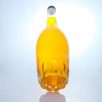 China Customization Round Shape Liquor Bottle with Embossed Design and Customized Cork Cap for sale