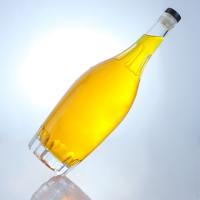 China Customization Round Shape Liquor Bottle with Embossed Design and Customized Cork Cap for sale