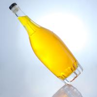 China Customization Round Shape Liquor Bottle with Embossed Design and Customized Cork Cap for sale
