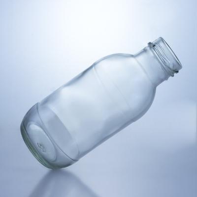Cina 300 ml Bottiglia rotonda di latte in vetro con coperchio Soluzione di conservazione liquori Manipolazione della superficie deccale in vendita