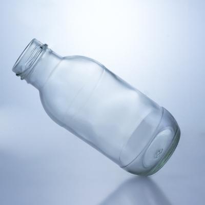 Cina 300 ml Bottiglia rotonda di latte in vetro con coperchio Soluzione di conservazione liquori Manipolazione della superficie deccale in vendita