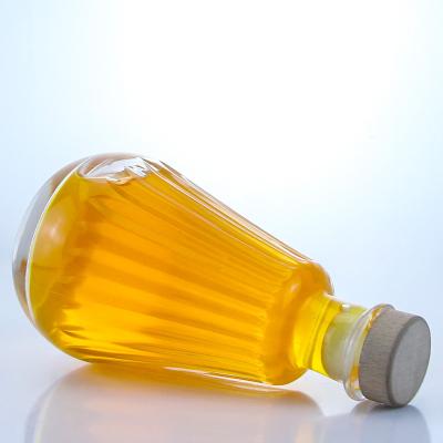 Cina Bottiglia di vetro rotonda con tappo di sughero e logo personalizzato per rum vodka whisky tequila gin in vendita