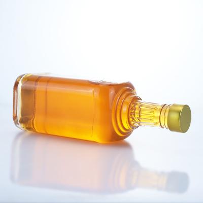 China Whisky Collar Material Glass 750ml Liquor Glass Bottle with Unique Shape and Cork for sale