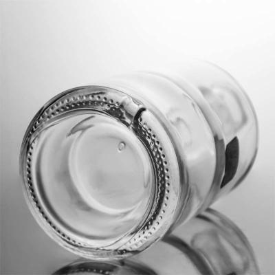 Cina Bottiglia di vetro di 750 ml a forma rotonda con sughero di legno per il whisky in vendita