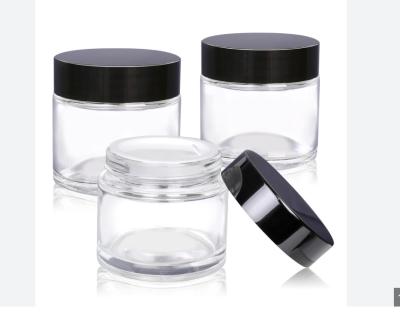 China Smooth Surface Round Glass Cosmetic Jars with Customized Logo Collection for sale