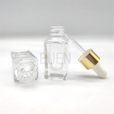 China Empty Glass Clear Serum Bottles Square With Wood Grain Dropper Cap for sale
