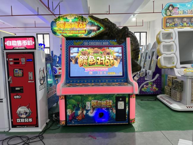 Side view of arcade machine with detailed crocodile artwork