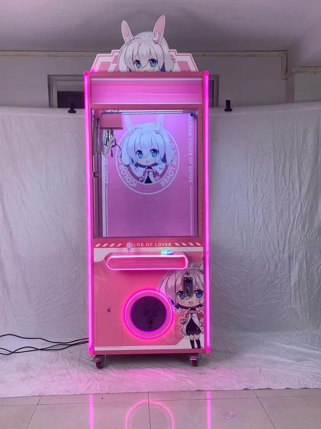 Close-up of claw mechanism and prize compartment