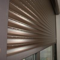 China Windproof Function VERTICAL Opening Pattern Aluminum Alloy Warehouse Door for Storage for sale