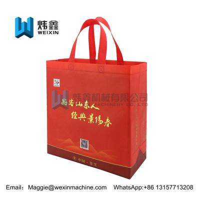 China Customized Red Eco Non Woven Bags With Tote Handles Foldable Bag 100gsm for sale
