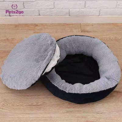 中国 OEMのドーナツ型ののどの毛皮心地よい静まる犬のベッド 販売のため
