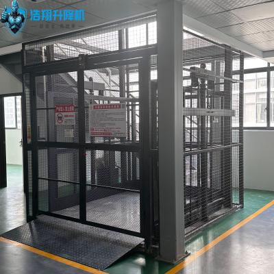 China 2T 6M Hydraulic Guide Rail Freight Platform Lift Material Handling For Stairs Double Door for sale