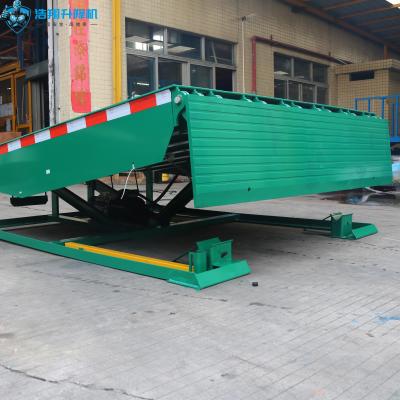 China Portable Unloading Electric Hydraulic Leveler Scissor Dock Lifting Table Platform 6.8-15Ton for sale
