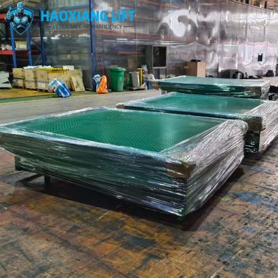 China 5T-18T Hydraulic Dock Leveler with Adjustable Height – Slip-Resistant Surface for Cargo Transfer Between Dock & Truck for sale