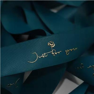 Cina Spirale di nastro di poliestere personalizzato con foglio oro 3D e logo stampato in vendita