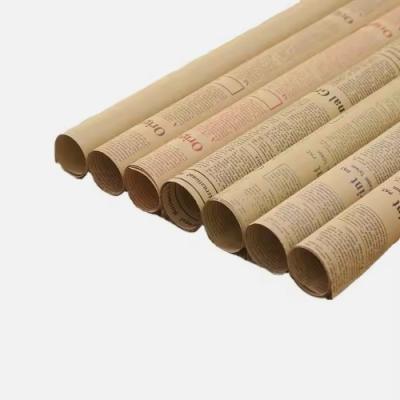Cina Nuovo design stampa giornale carta Kraft carta di avvolgimento carta artigianale per fiori carta di avvolgimento per fiori in vendita