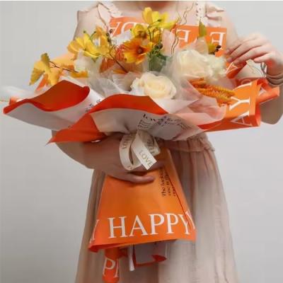 China Alphabet Pattern Plastic Waterproof Flower Wrapping Paper Flower Packaging Paper Wrap gift crepe papers packaging for sale