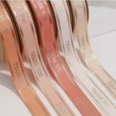 Cina Nastro personalizzato in poliestere in foglio d'oro con logo 3D per Natale e compleanno in vendita