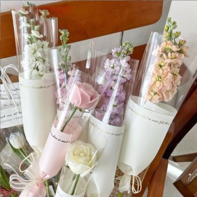China Cross-border single bouquet wrapping paper, transparent single goddess single flower, single flower bag, English floral materials for sale