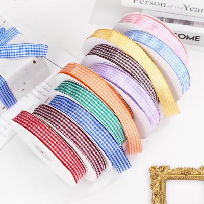 Cina Produttore all'ingrosso 2cm nastro a quadri scozzese, nastro a quadri, nastro britannico, accessori per abbigliamento, materiali fai da te fatti a mano in vendita