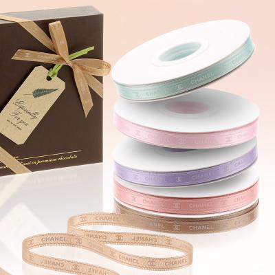 China 1cm Small Fragrant Printed Polyester Ribbon Customized Logo Flower Packaging Ribbon Color Ribbon Birthday Cake Box Strap for sale