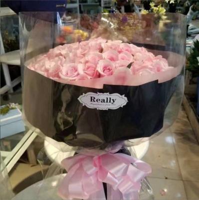 Cina Sconti su grandi quantità: imballaggio trasparente di cellophane per fiori, carta impermeabile, pellicola opp, base per la cottura di torte, carta da imballaggio per fiori in vendita