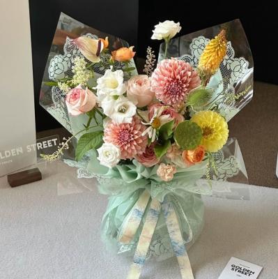 中国 花の愛,人民の日,小さな蕾,セルロファン,蕾の縁,ウォーターバッグ,花の紙,花屋さん,人気の花束の包装材料 販売のため