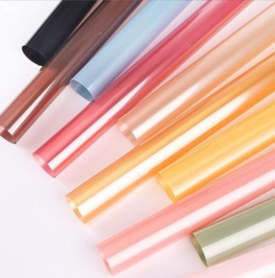 China Colored cellophane OPP jelly film packaging paper, flower wrapping paper, bouquet packaging materials, waterproof flower shop materials for sale