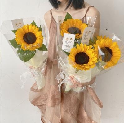Cina Giornata dell'insegnante inglese trasparente opp plastica impermeabile cellophane materiale di imballaggio per fiori Fiore di girasole Bocchetto di carta da imballaggio in vendita