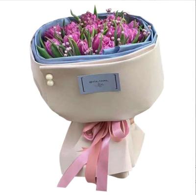 China 20 pieces of solid-color flower wrapping paper with good texture and firmness, a popular Russian round bouquet wrapping paper for sale