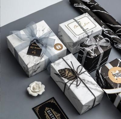 China Black marble-patterned flower wrapping paper packaging material, flower shop supplies flower wrapping paper gift wrapping paper fruit wrapping paper for sale