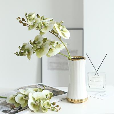 China A fresh and elegant 3D printed 7-head film Phalaenopsis artificial flower, light luxury home living room and dining table floral arrangement artificial flower for sale